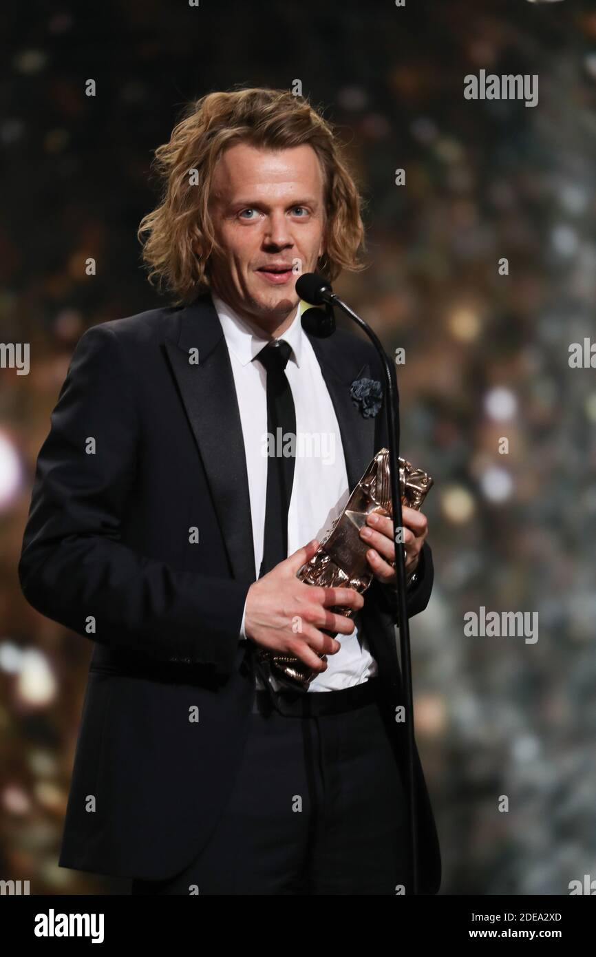 French director and actor Alex Lutz receives the Best Actor award for ...