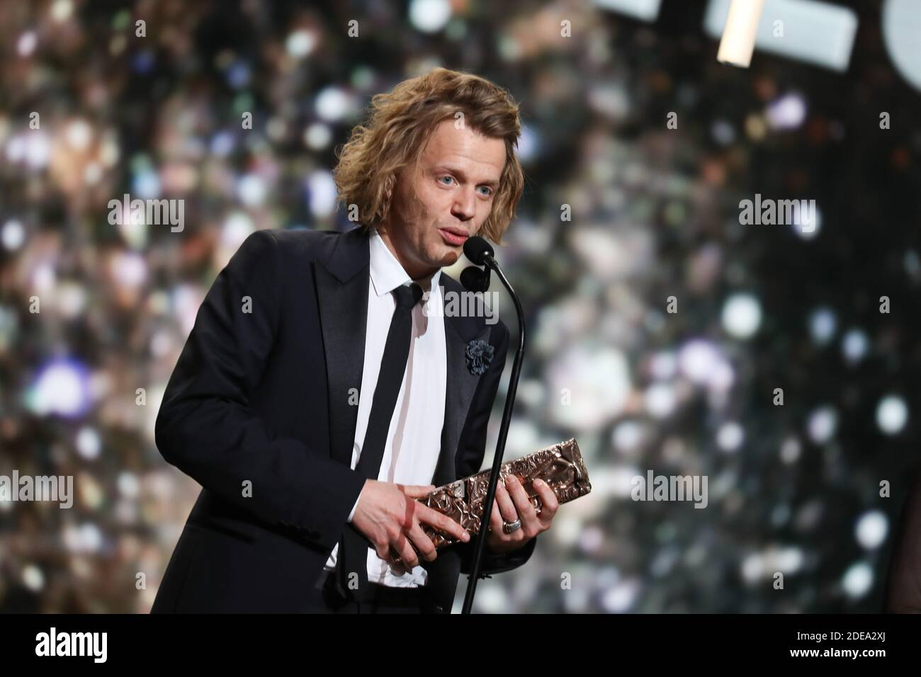 French director and actor Alex Lutz receives the Best Actor award for ...
