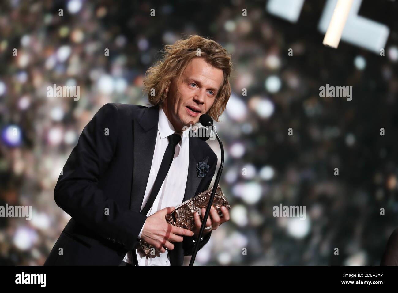French director and actor Alex Lutz receives the Best Actor award for ...