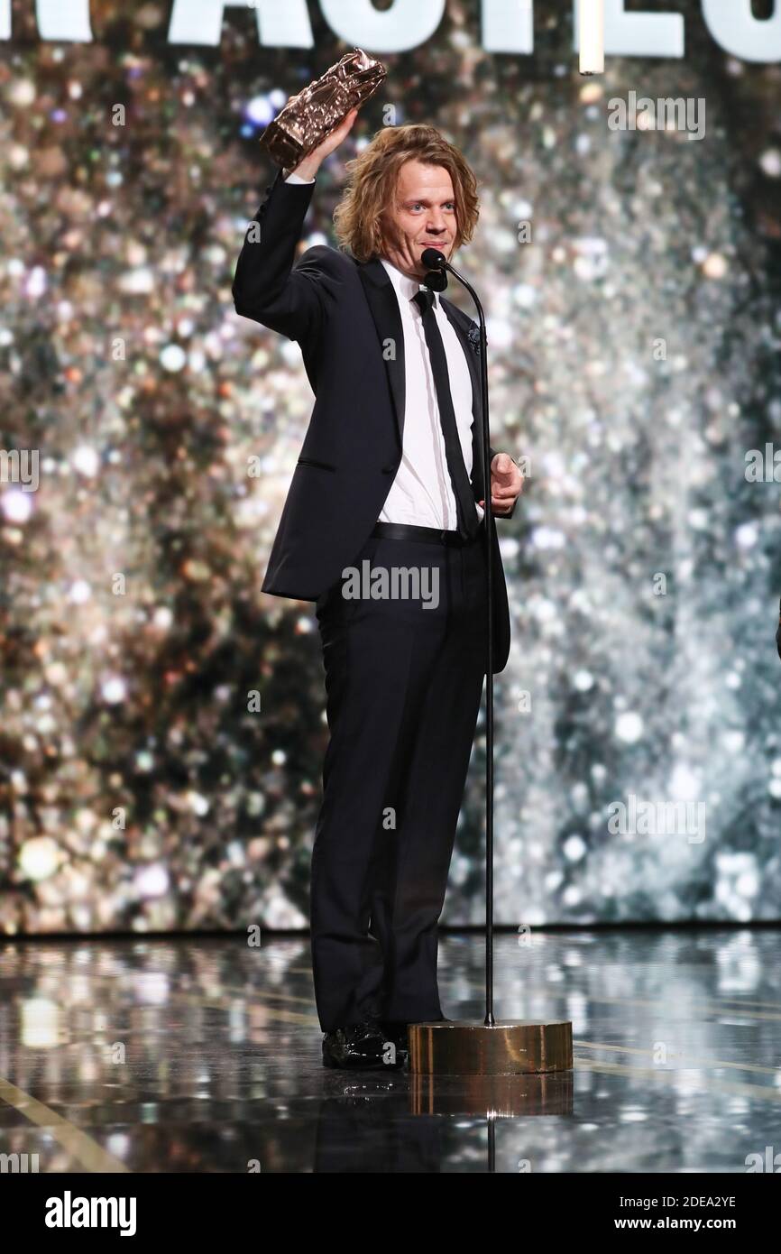 French director and actor Alex Lutz receives the Best Actor award for ...
