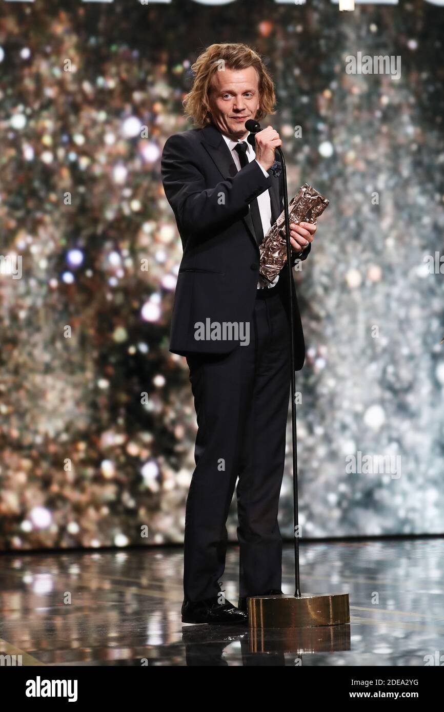 French director and actor Alex Lutz receives the Best Actor award for ...