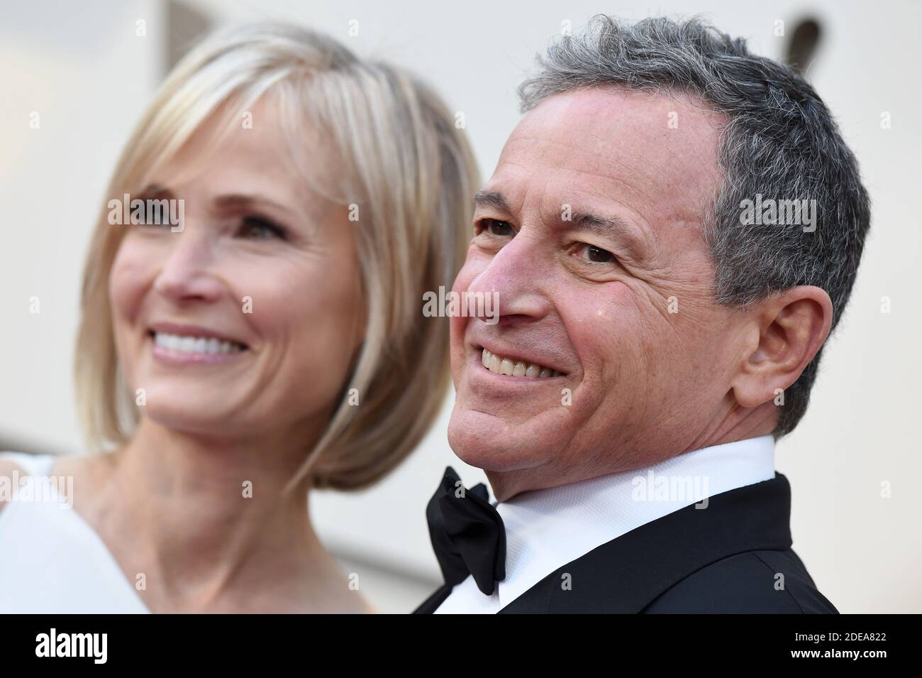 Willow Bay (L) and Robert Iger (R) walking the red carpet as arriving ...