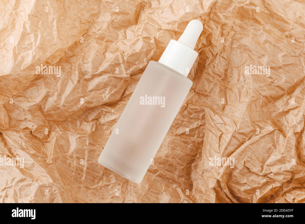 Hyaluronic acid tincture on creased cardboard. Serum with collagen and ...