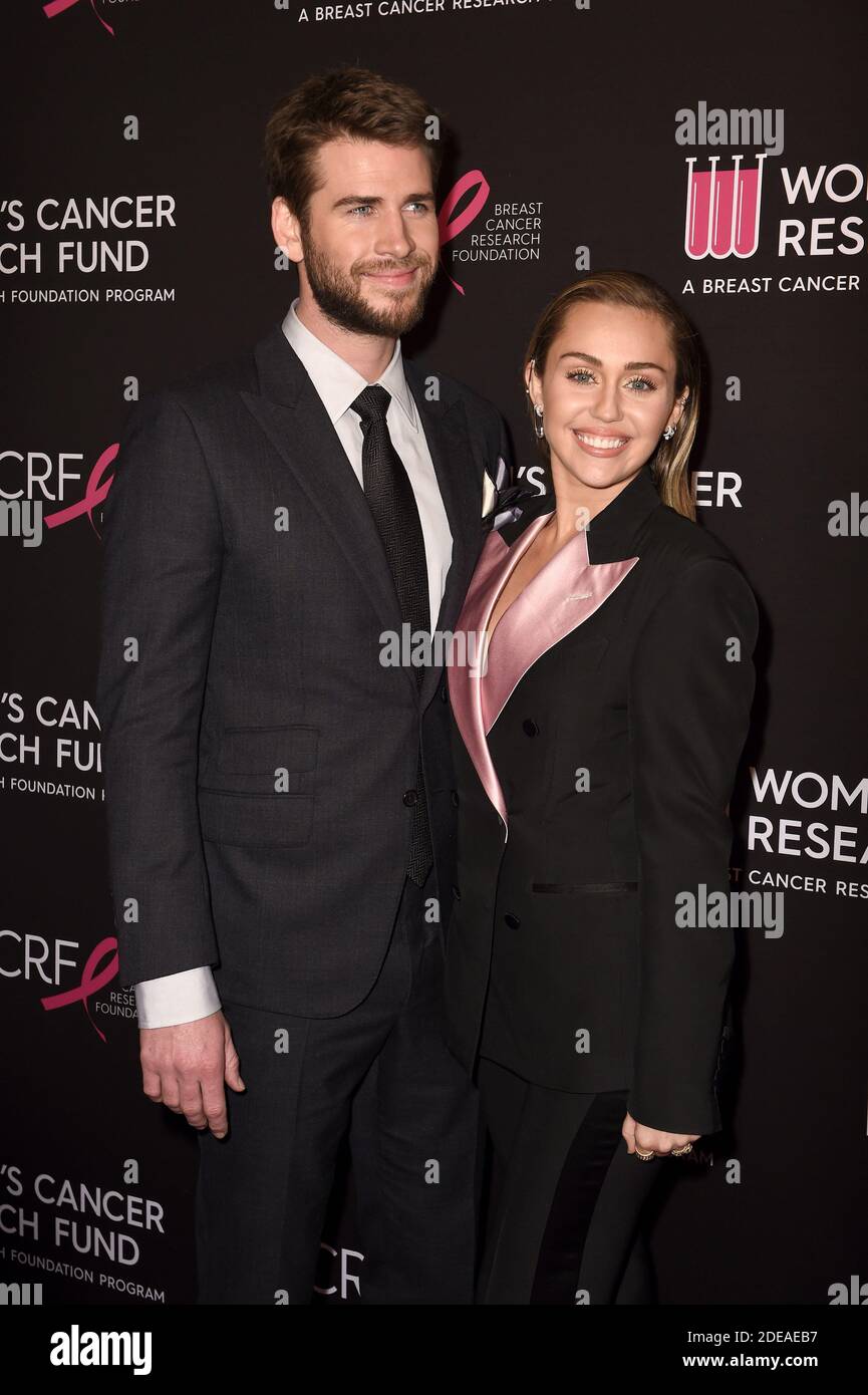 Liam Hemsworth and Miley Cyrus attend the Women's Cancer Research Fund ...