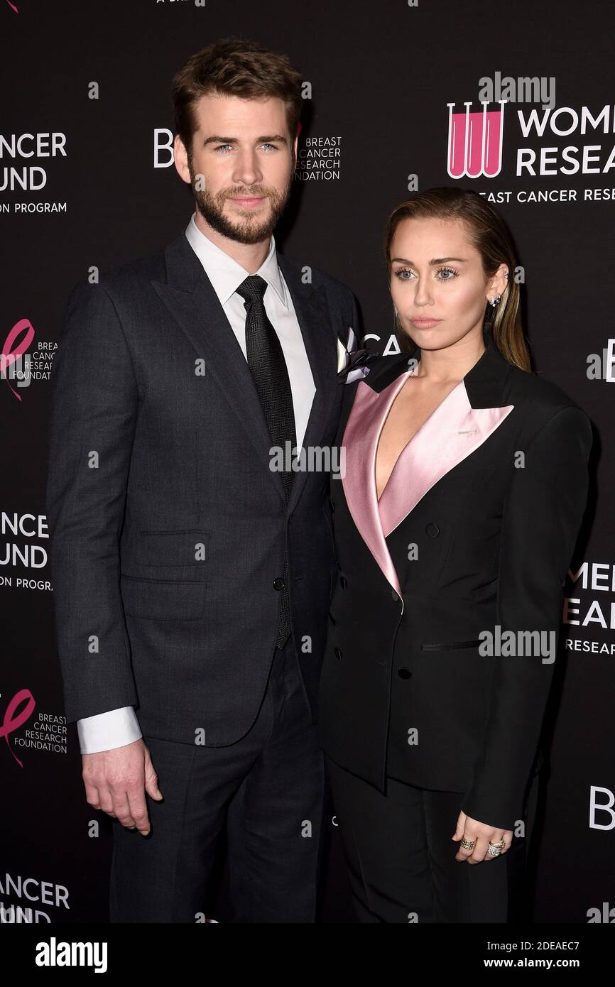 Liam Hemsworth and Miley Cyrus attend the Women's Cancer Research Fund ...