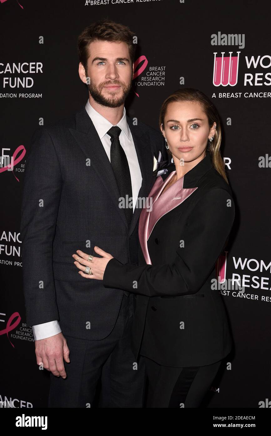 Liam Hemsworth and Miley Cyrus attend the Women's Cancer Research Fund ...