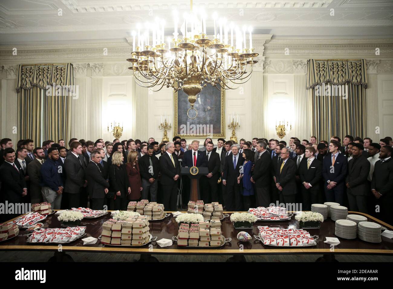 President Donald Trump speaks behind a table full of McDonald's ...