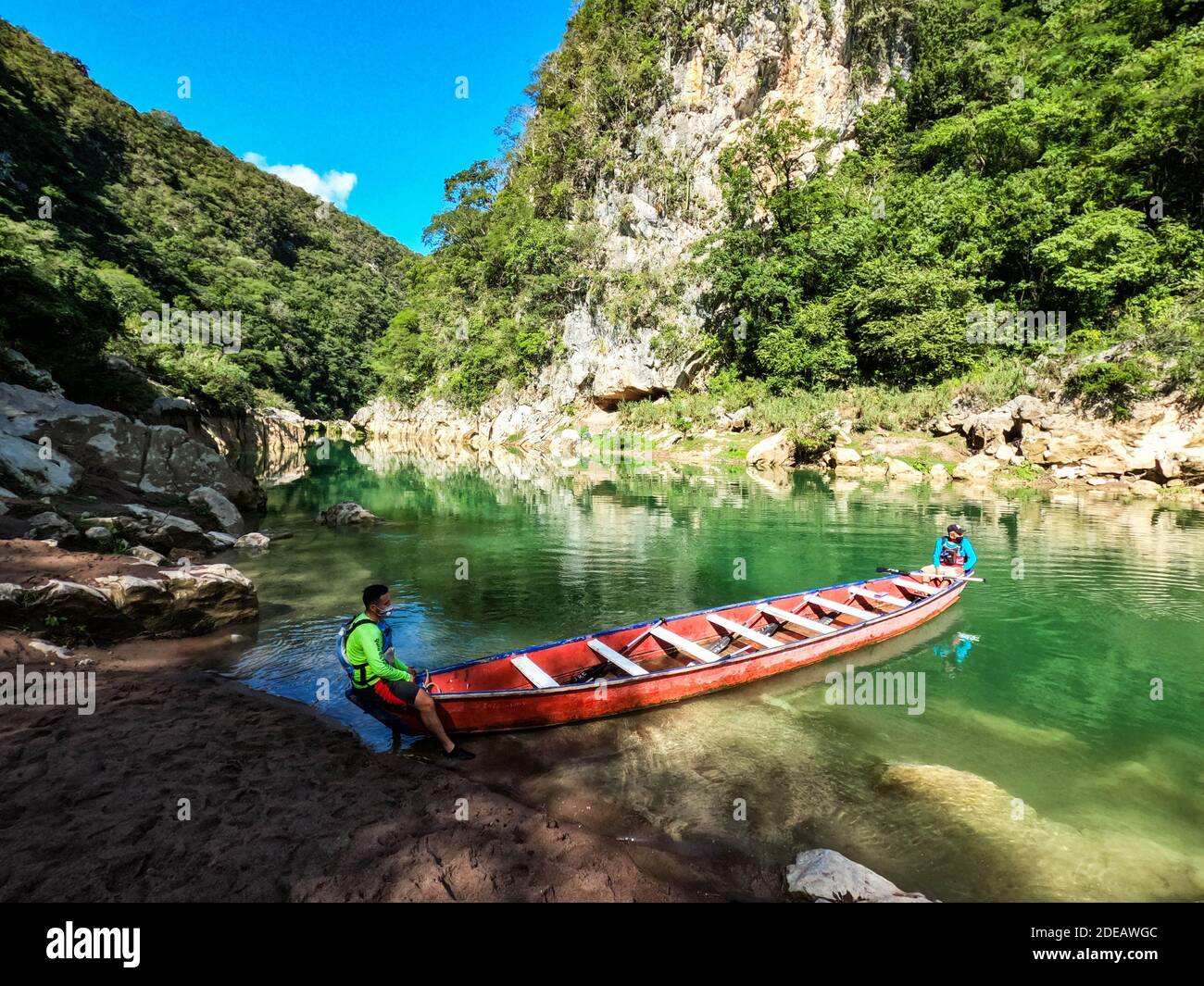 Preparing to portage on the way to Tamul Falls, Tampaon River, San Luis ...