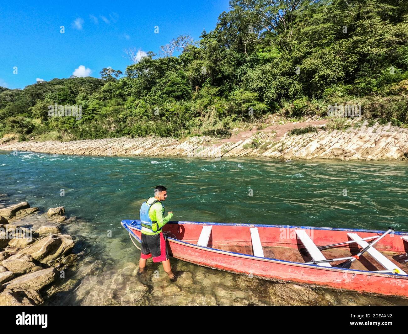 Preparing to portage on the way to Tamul Falls, Tampaon River, San Luis ...