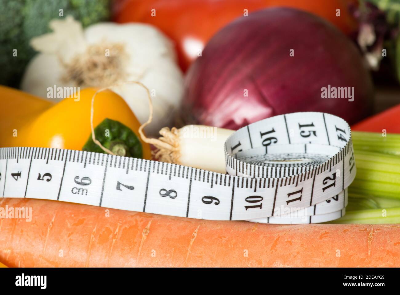 Different vegetables and a tape measure Stock Photo - Alamy