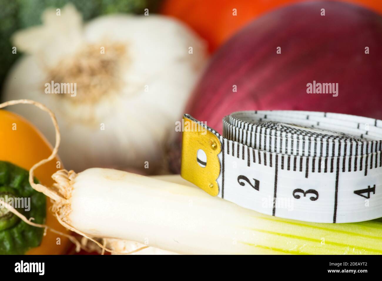 Different vegetables and a tape measure Stock Photo - Alamy