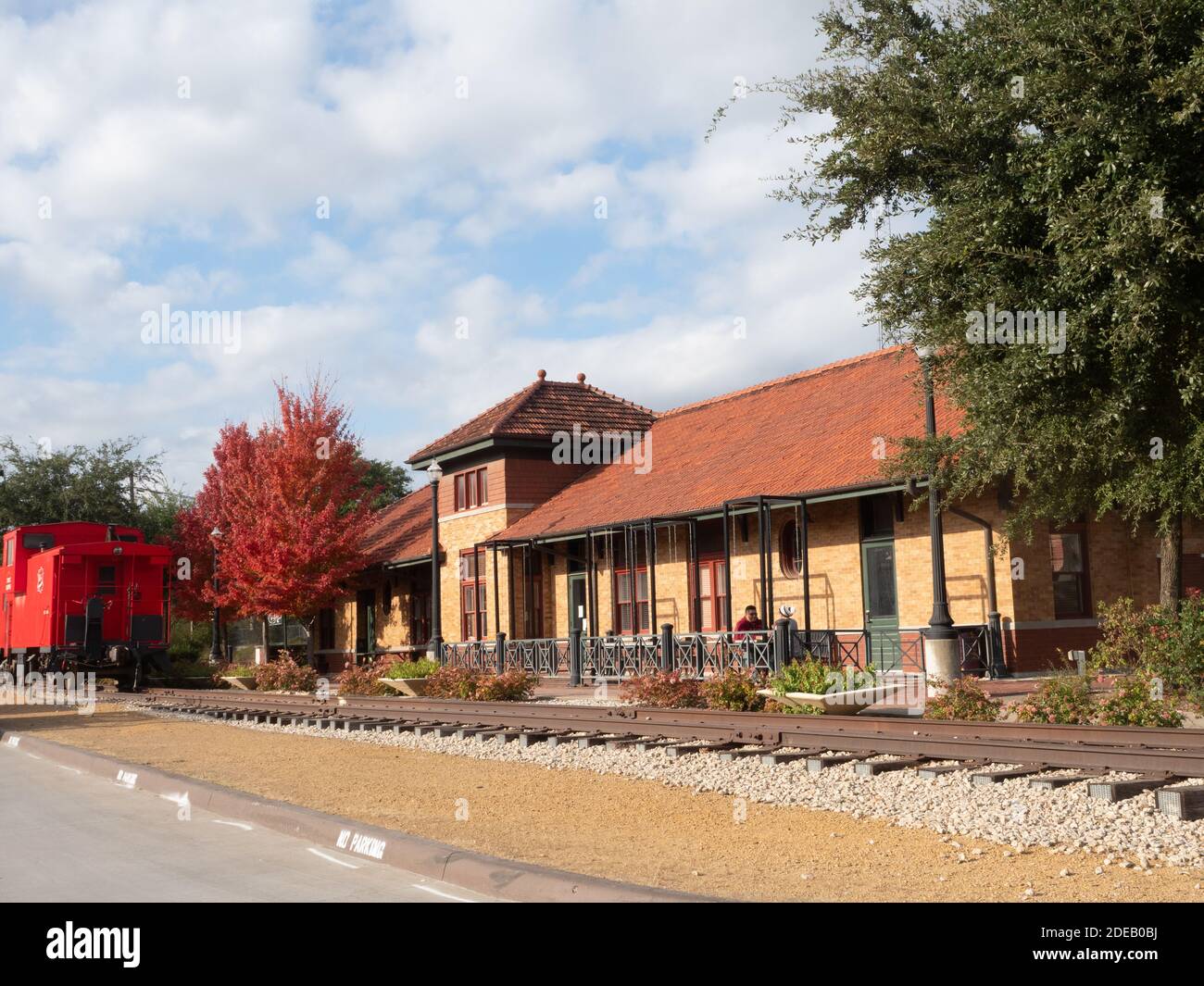 The Missouri-Kansas-Texas passenger train depot with an MKT caboose on ...