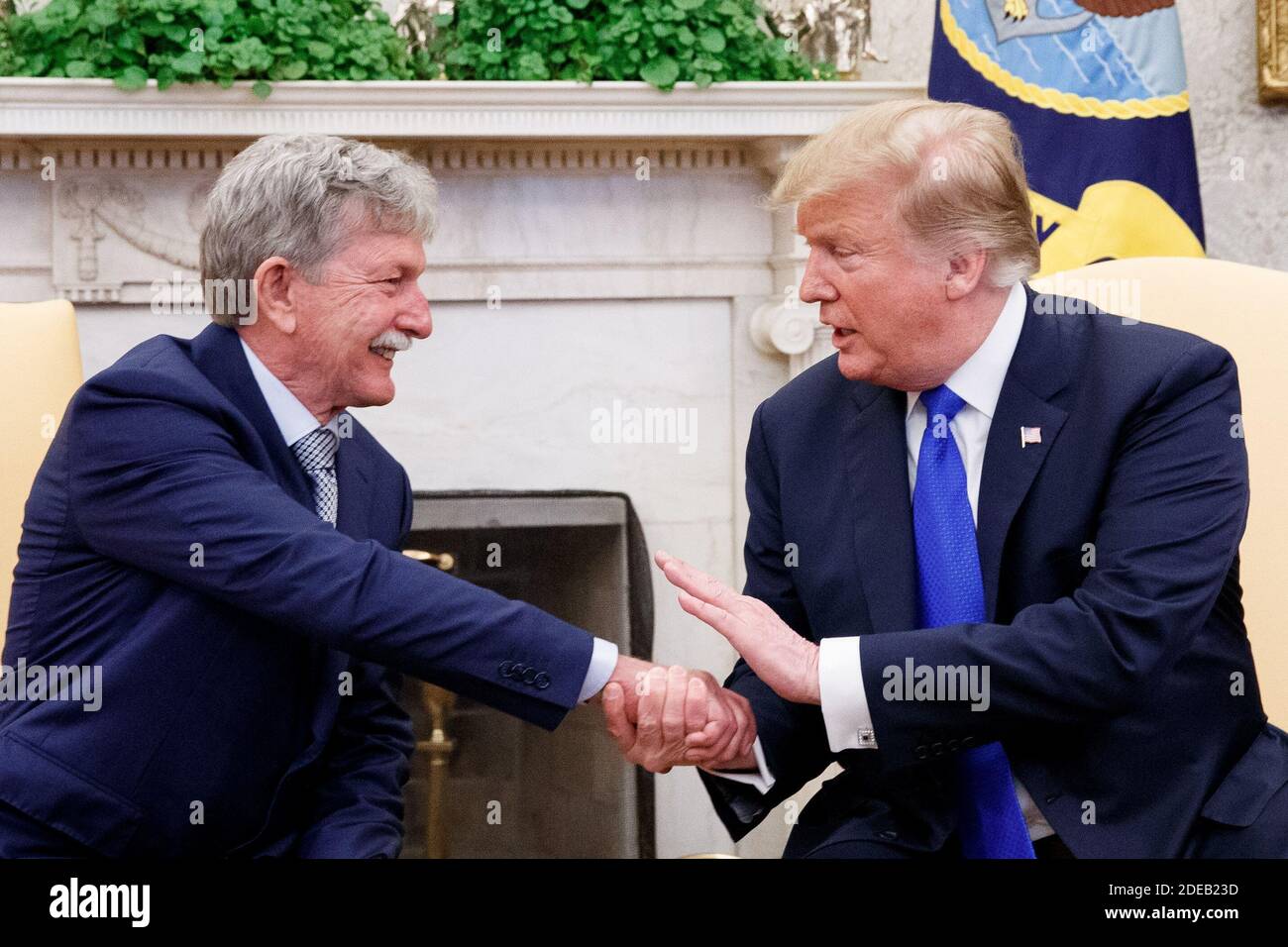 President Donald Trump shakes hands with Danny Burch, a former hostage ...