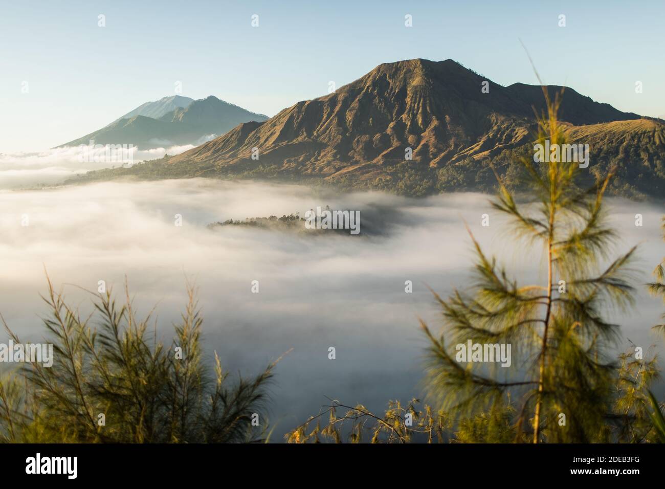 Sunrise view of mount Batur volcano in Bali from Pinggan village ...