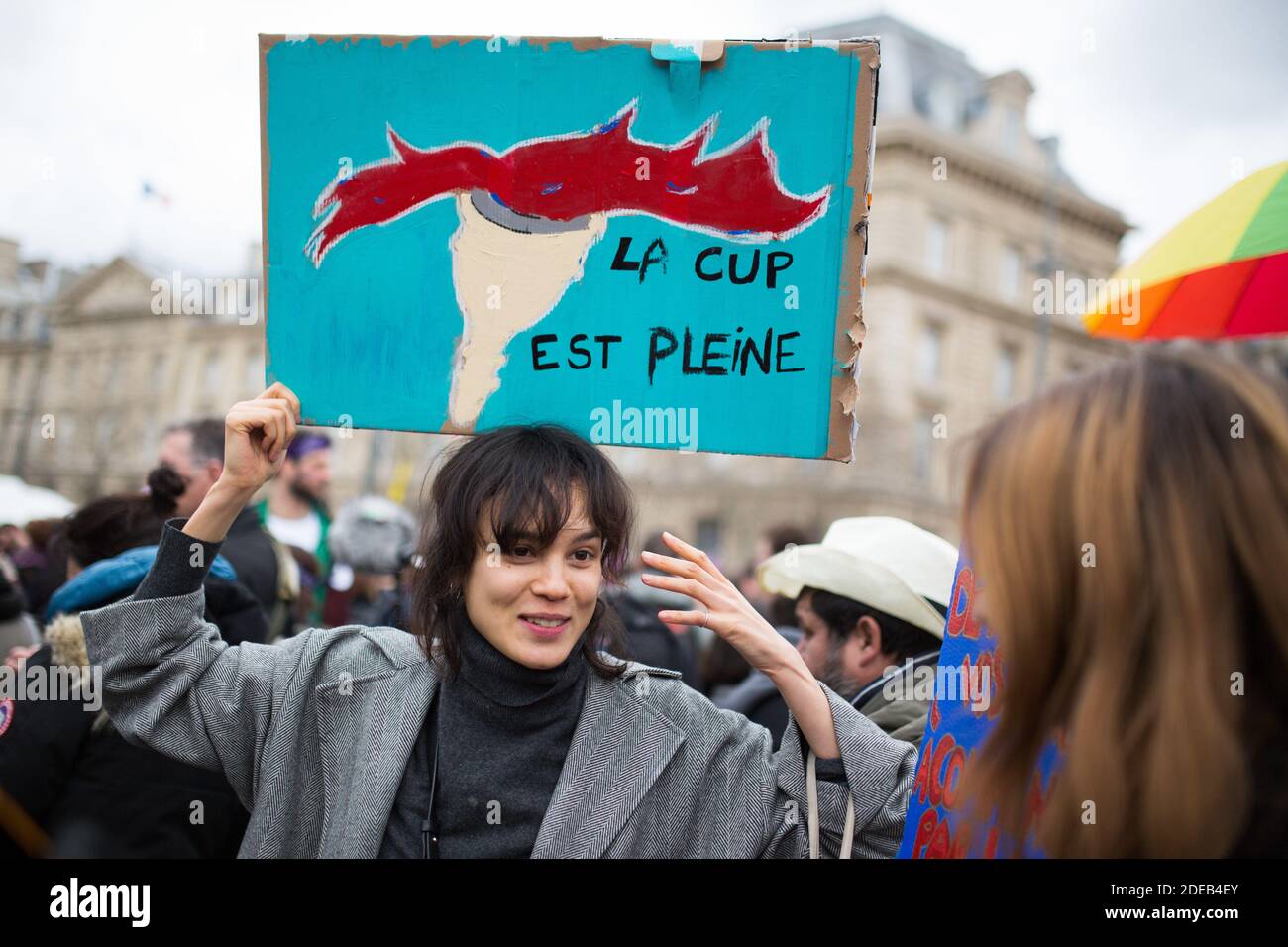 A women hold a sign "The cup is fool" ( La cup est pleine ) during the ...