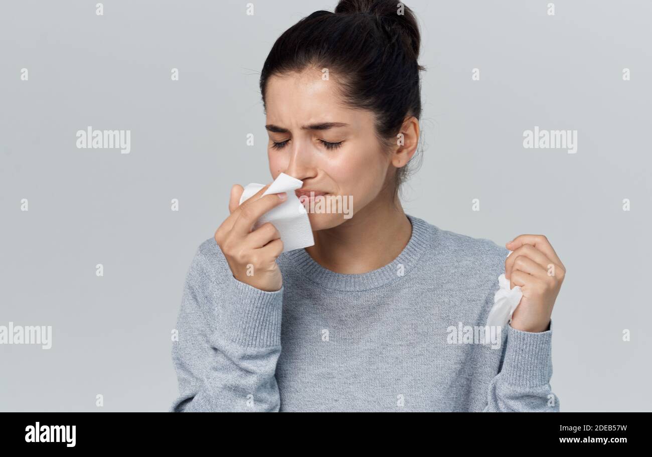 Woman holding napkin near face health problems runny nose flu Stock ...
