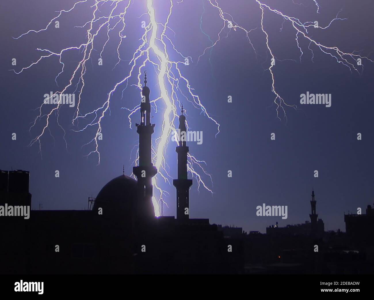Lightning silhouettes a mosque in Rafah, southern Gaza, on Thursday ...