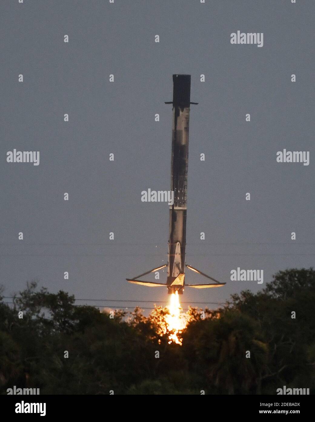 The first stage of a SpaceX Falcon 9 rocket returns to Landing Zone 1 ...