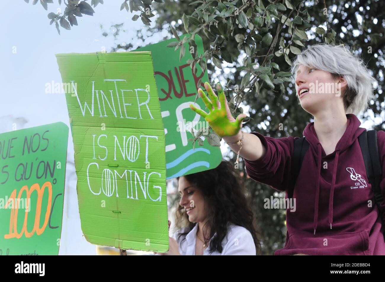 Youth hold banners during a demonstration against climate change on ...