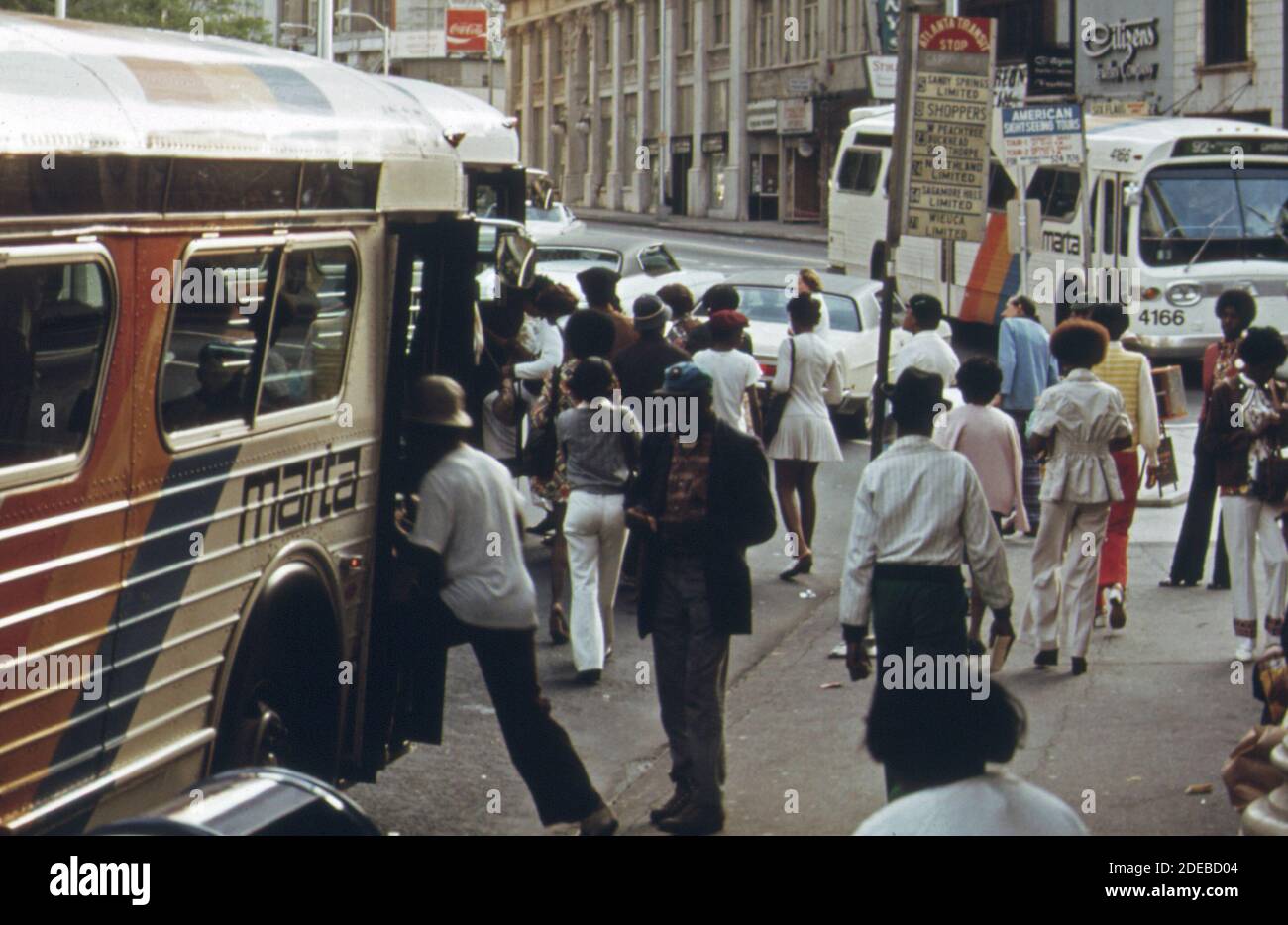 Passengers in Atlanta; Georgia; board a Metropolitan Atlanta Rapid ...