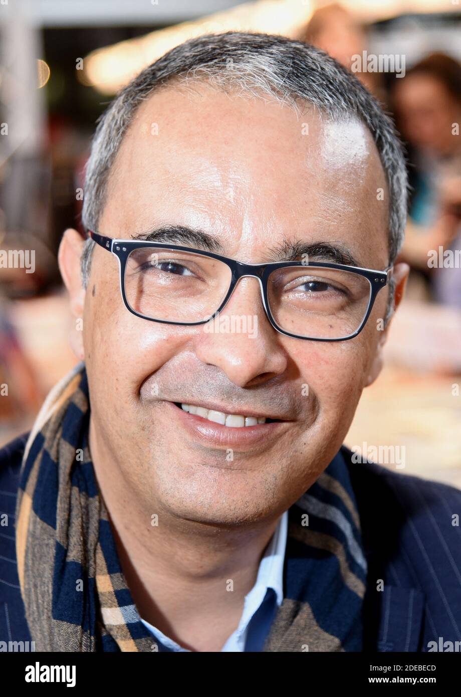 Kamel Daoud signs his book at The Book Fair in Paris, France on March ...