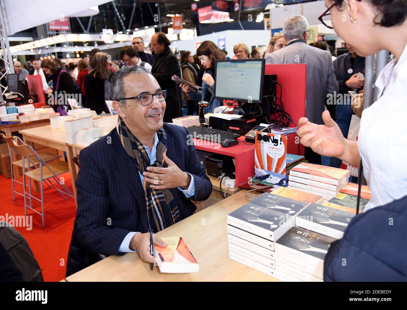 Kamel Daoud signs his book at The Book Fair in Paris, France on March ...