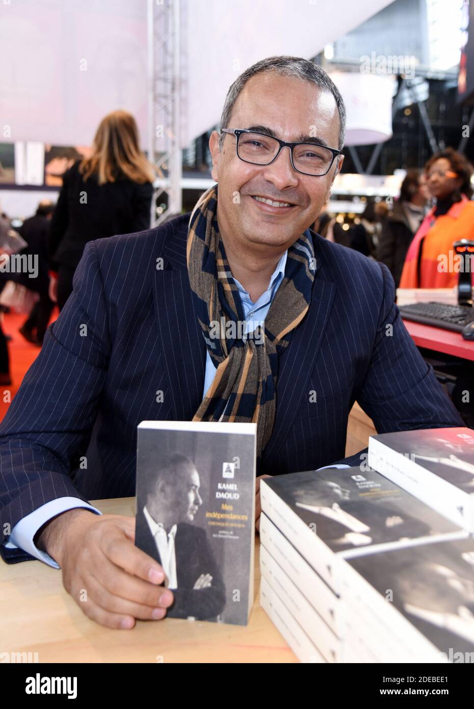 Kamel Daoud signs his book at The Book Fair in Paris, France on March ...