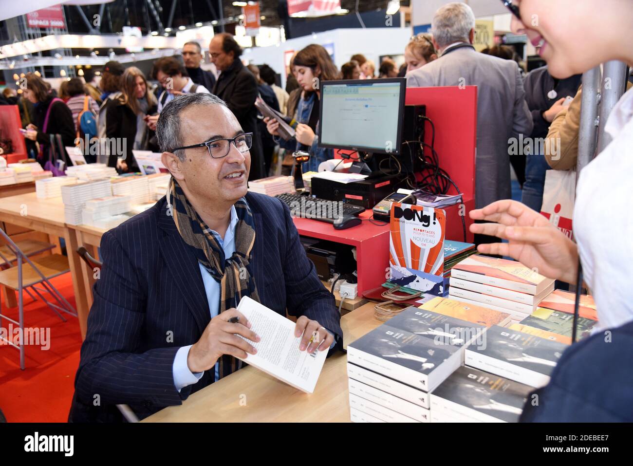 Kamel Daoud signs his book at The Book Fair in Paris, France on March ...