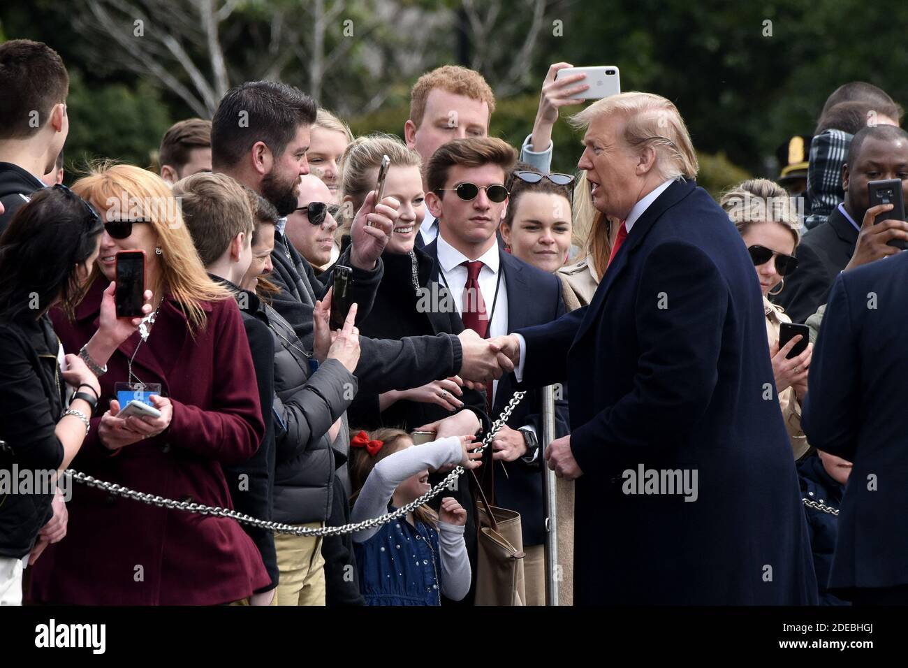US President Donald Trump greets supporters before departing the White ...