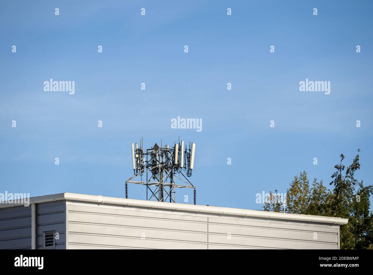 Wireless communication panel antennas mounted on a commercial rooftop ...