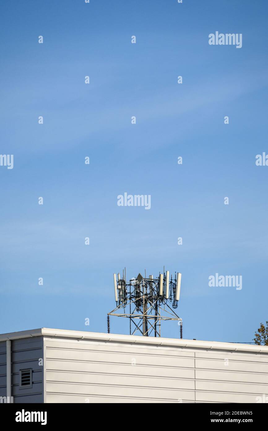 Wireless communication panel antennas mounted on a commercial rooftop ...