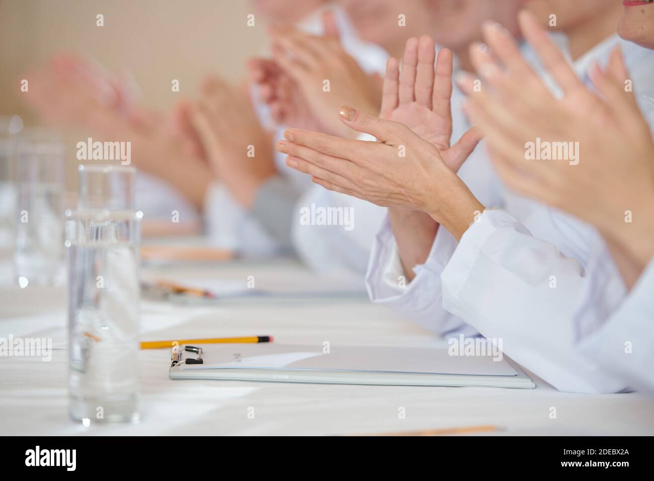 Clapping medical workers Stock Photo - Alamy