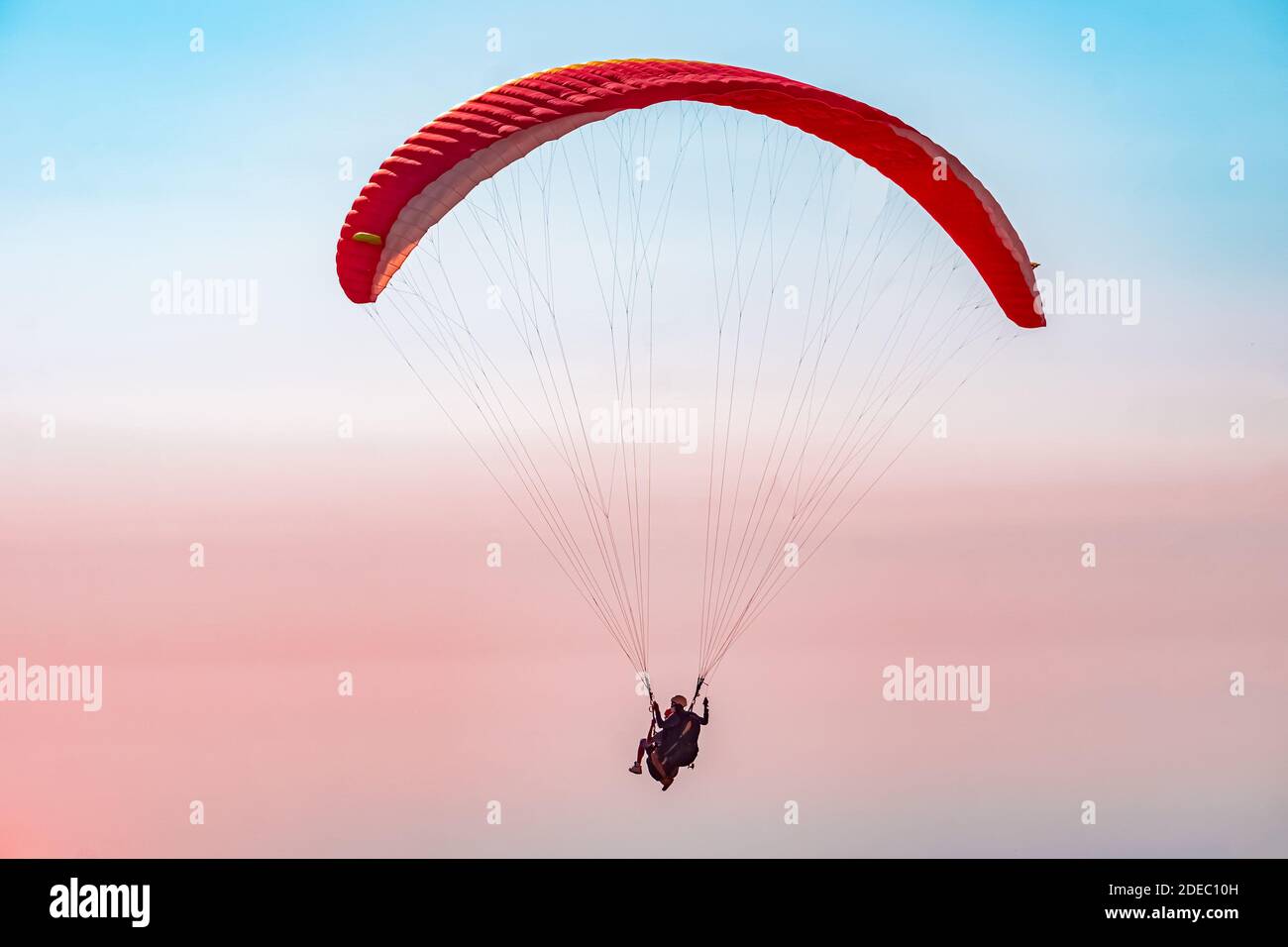 Paragliding in the sky. Paraglider tandem flying over the sea with ...