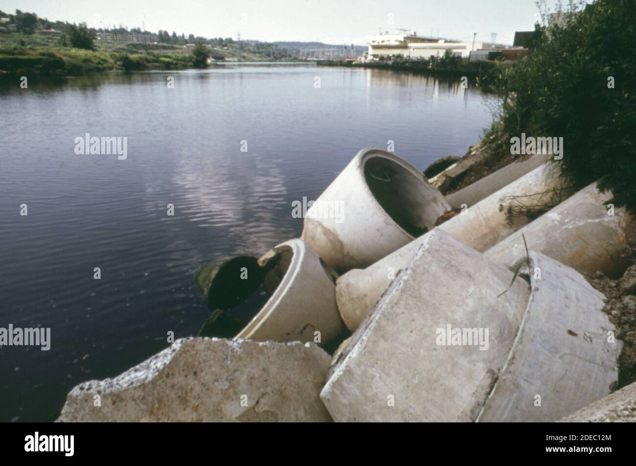 1970s Photo (1973) - Culvert pipe and cables dumped as riprap (a ...