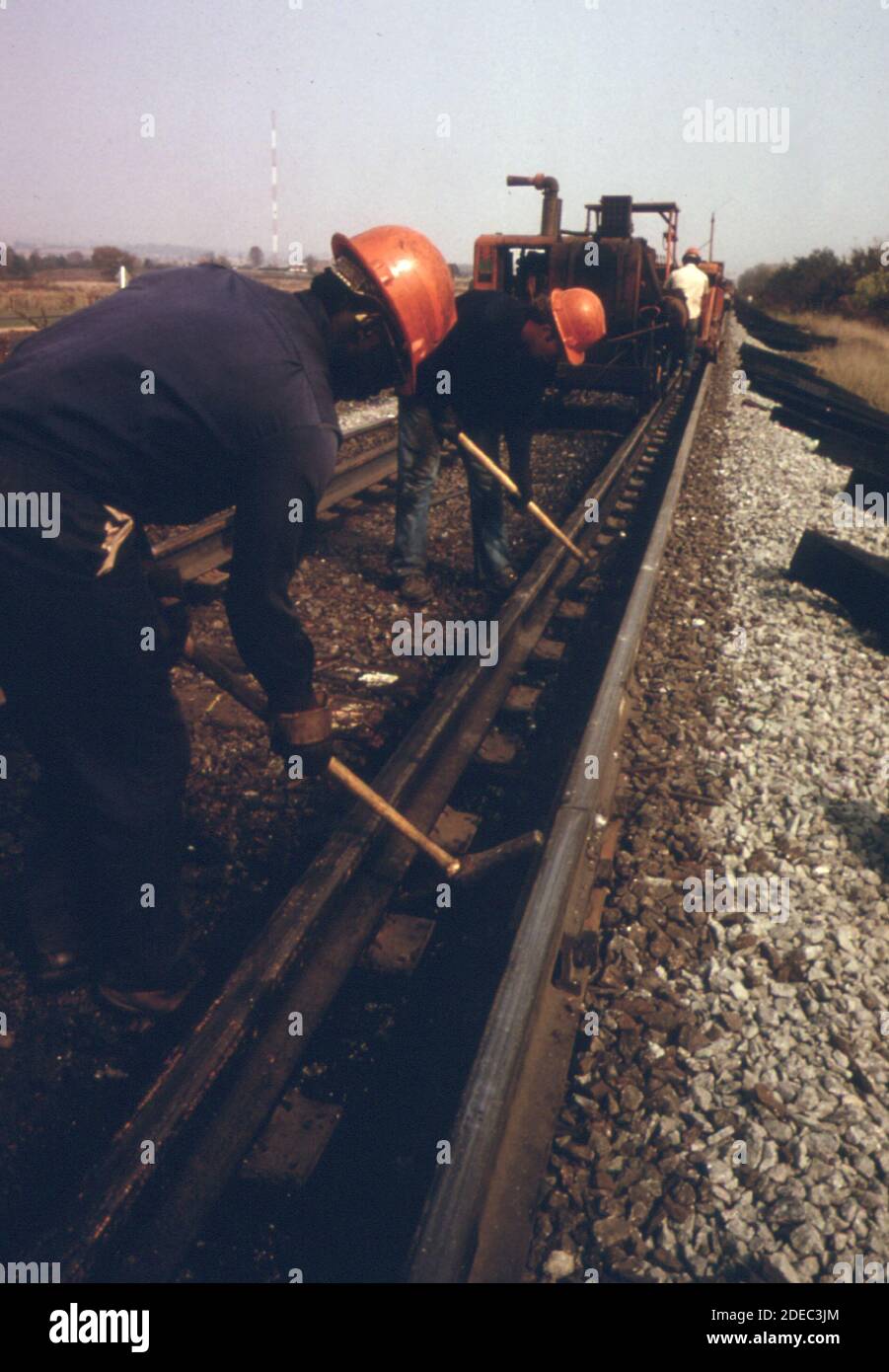 Southern Railway right-of-way work crew; position a portion of a ...