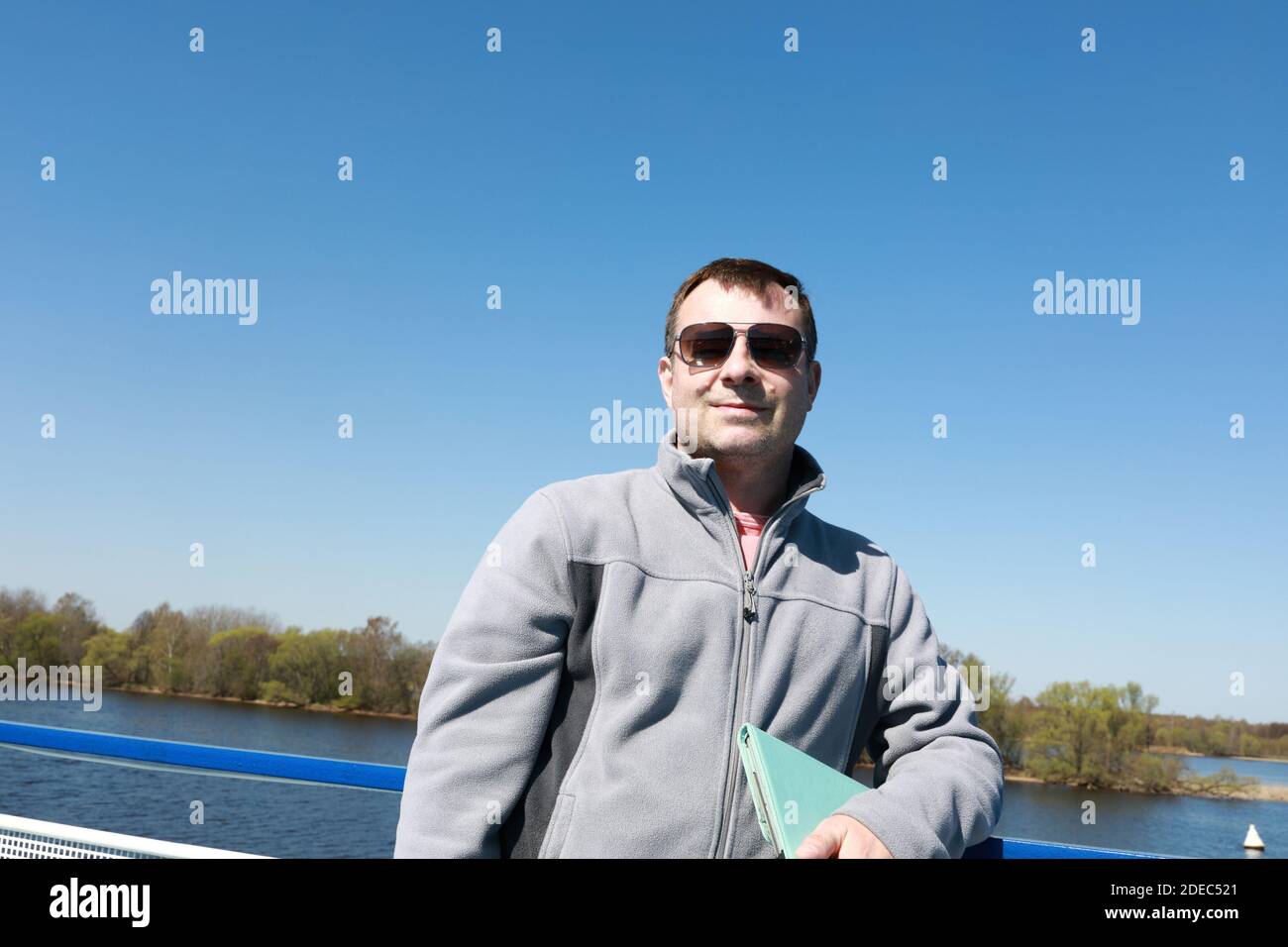 Portrait of man on top deck of ship Stock Photo - Alamy