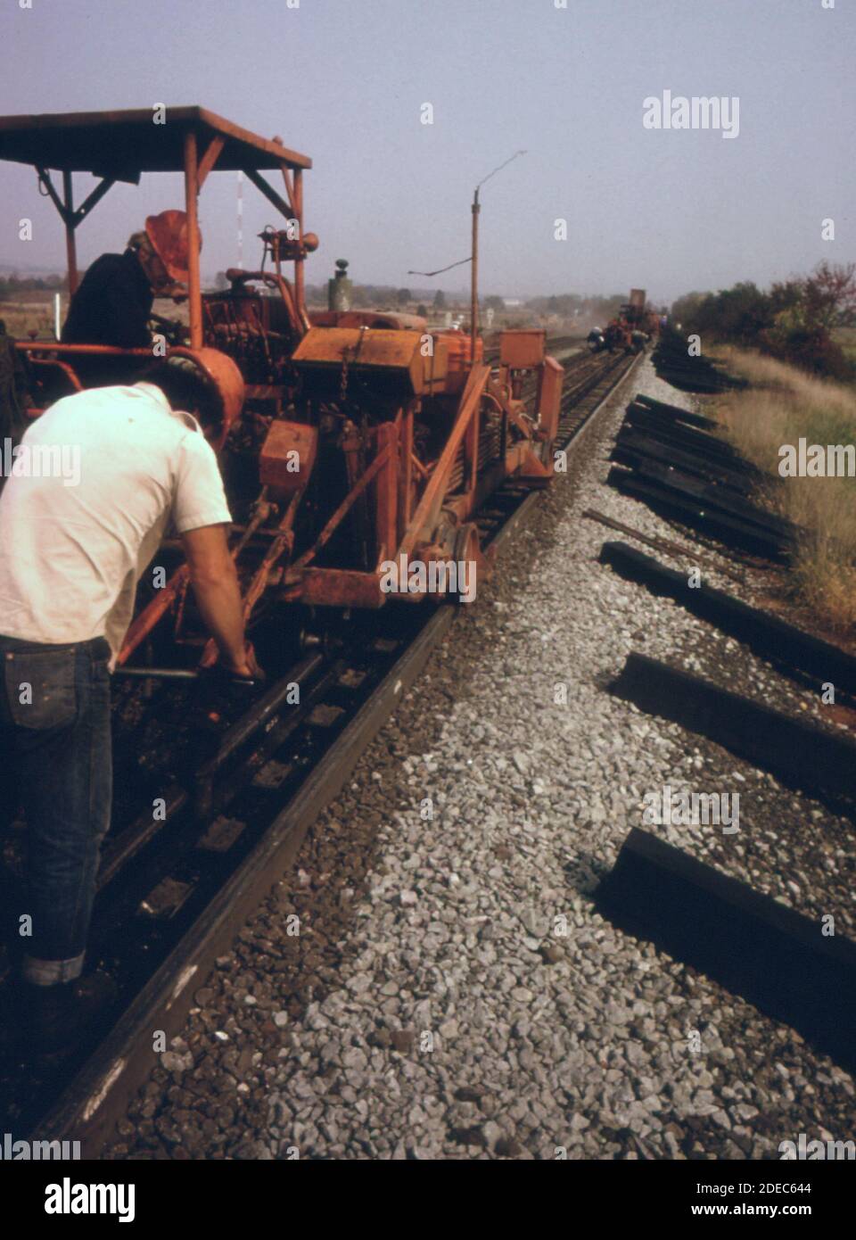 Southern Railway right-of-way work crew; with a machine that drives ...