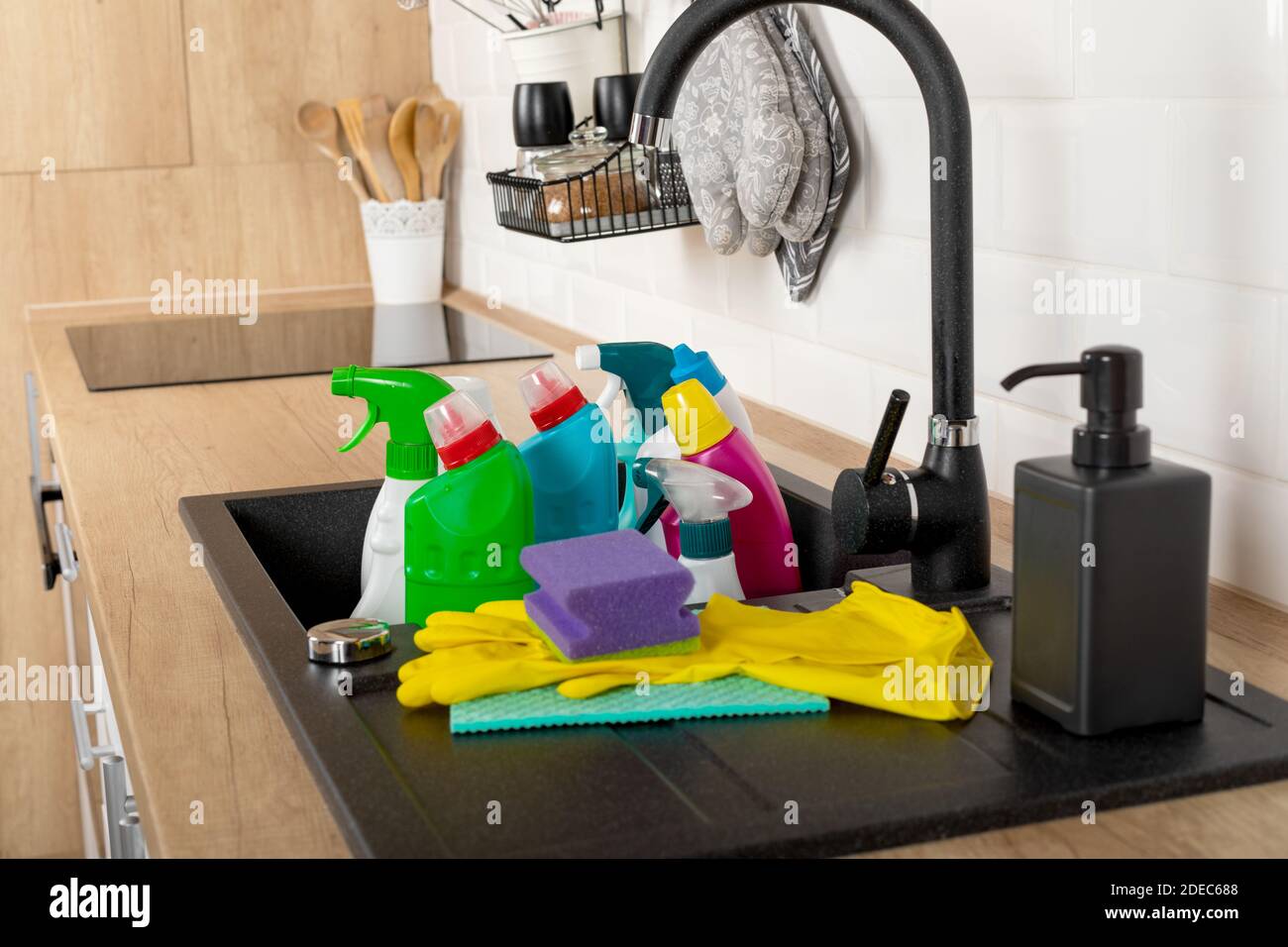 Colorful cleaning products in the kitchen Stock Photo - Alamy