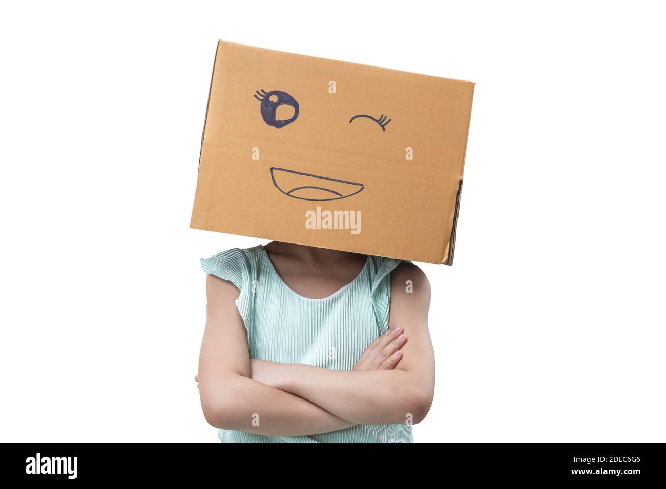 Little girl wearing cardboard box on his head with smiley face ...