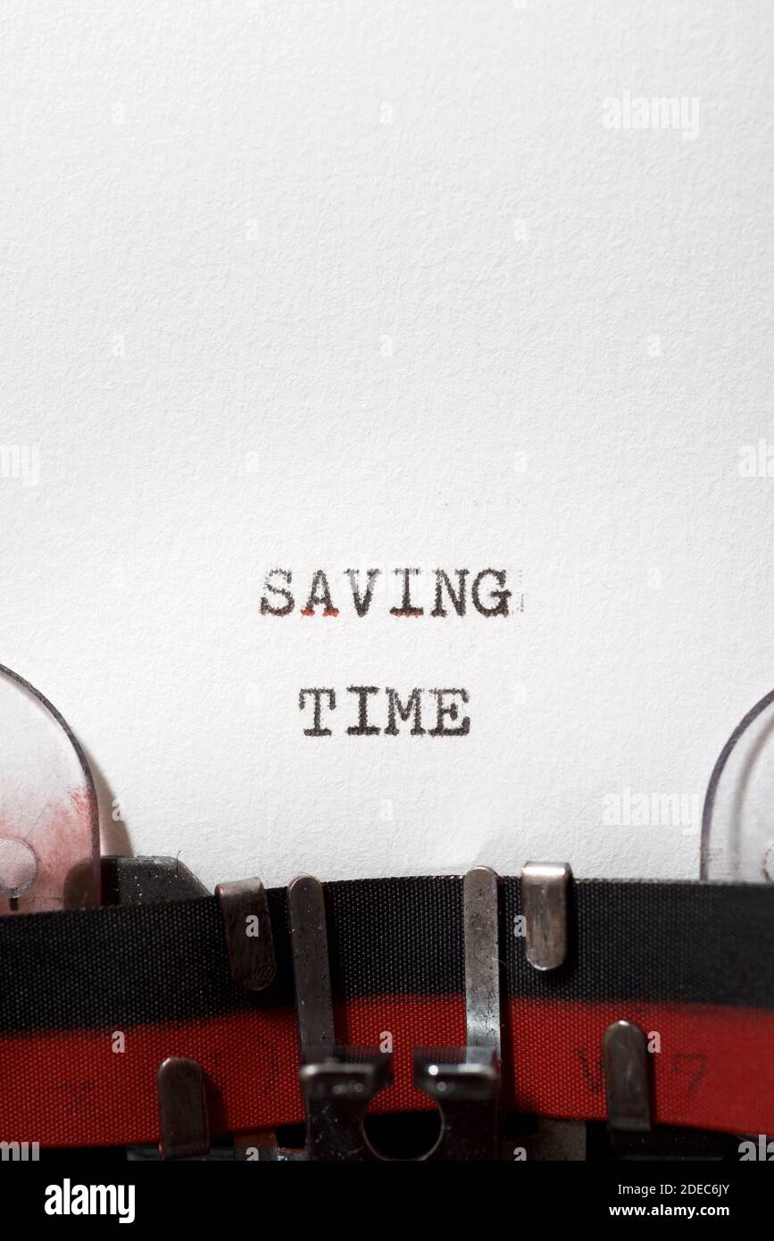 Saving time phrase written with a typewriter Stock Photo - Alamy