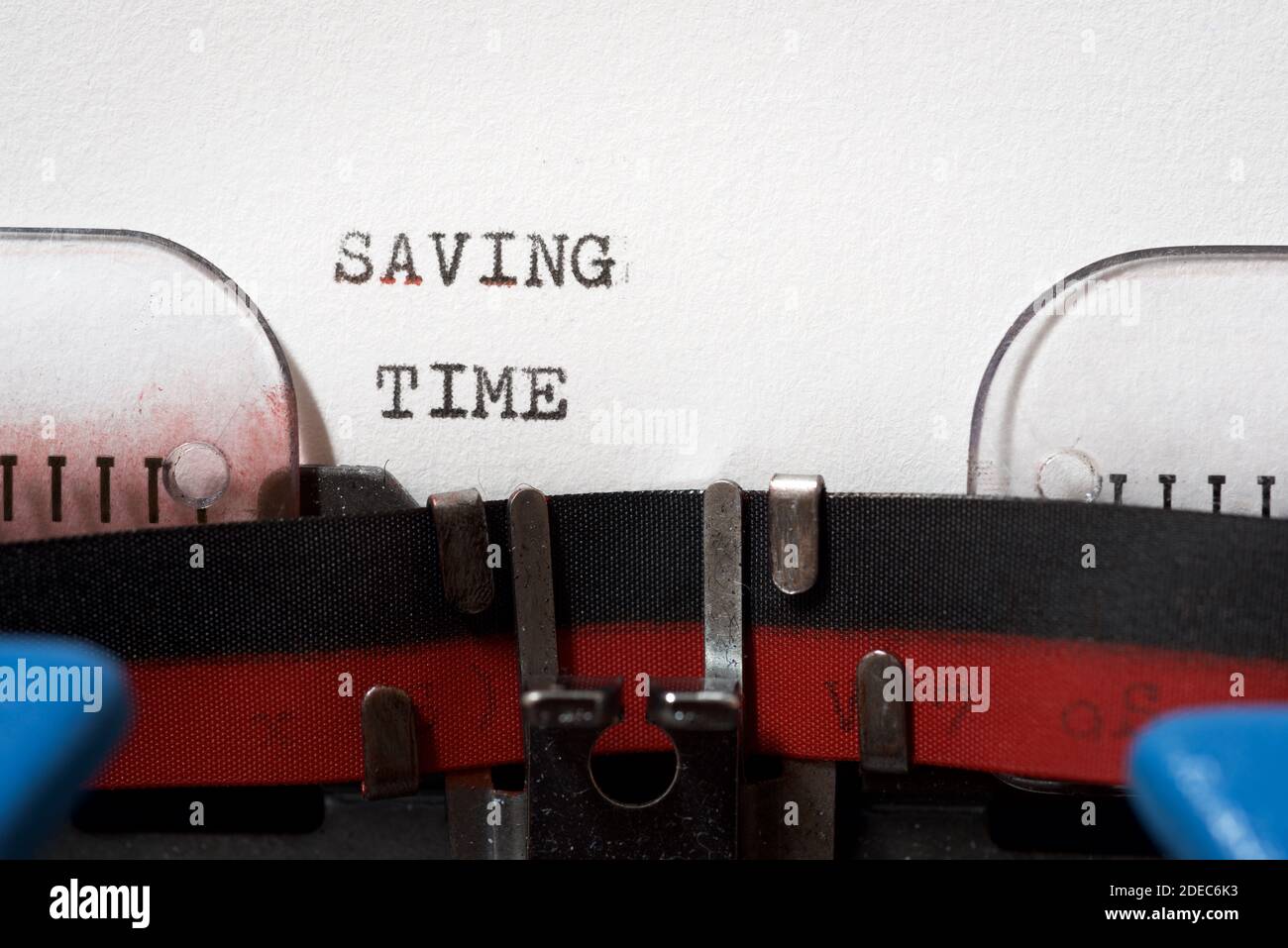 Saving time phrase written with a typewriter Stock Photo - Alamy