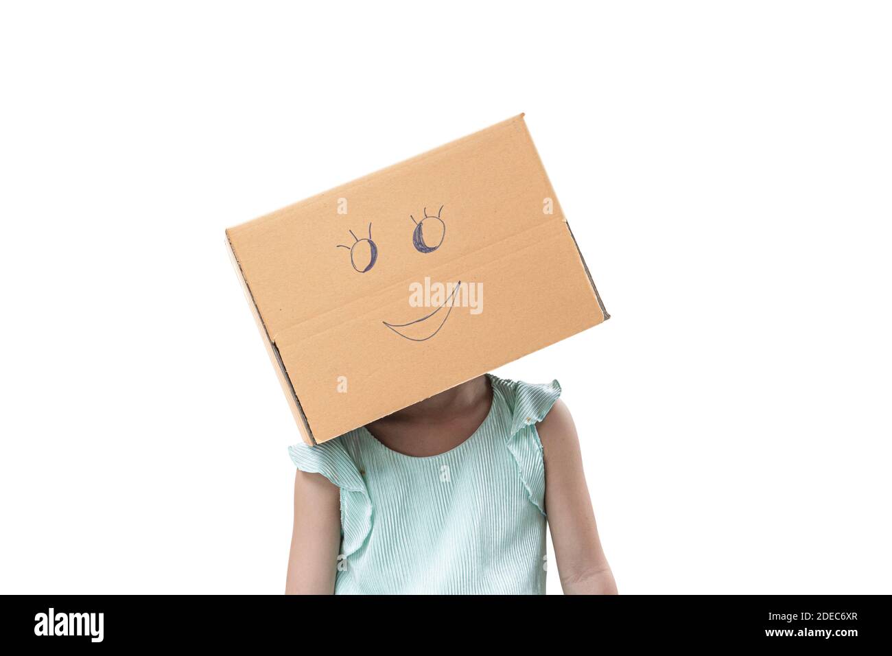 Little girl wearing cardboard box on his head with smiley face ...