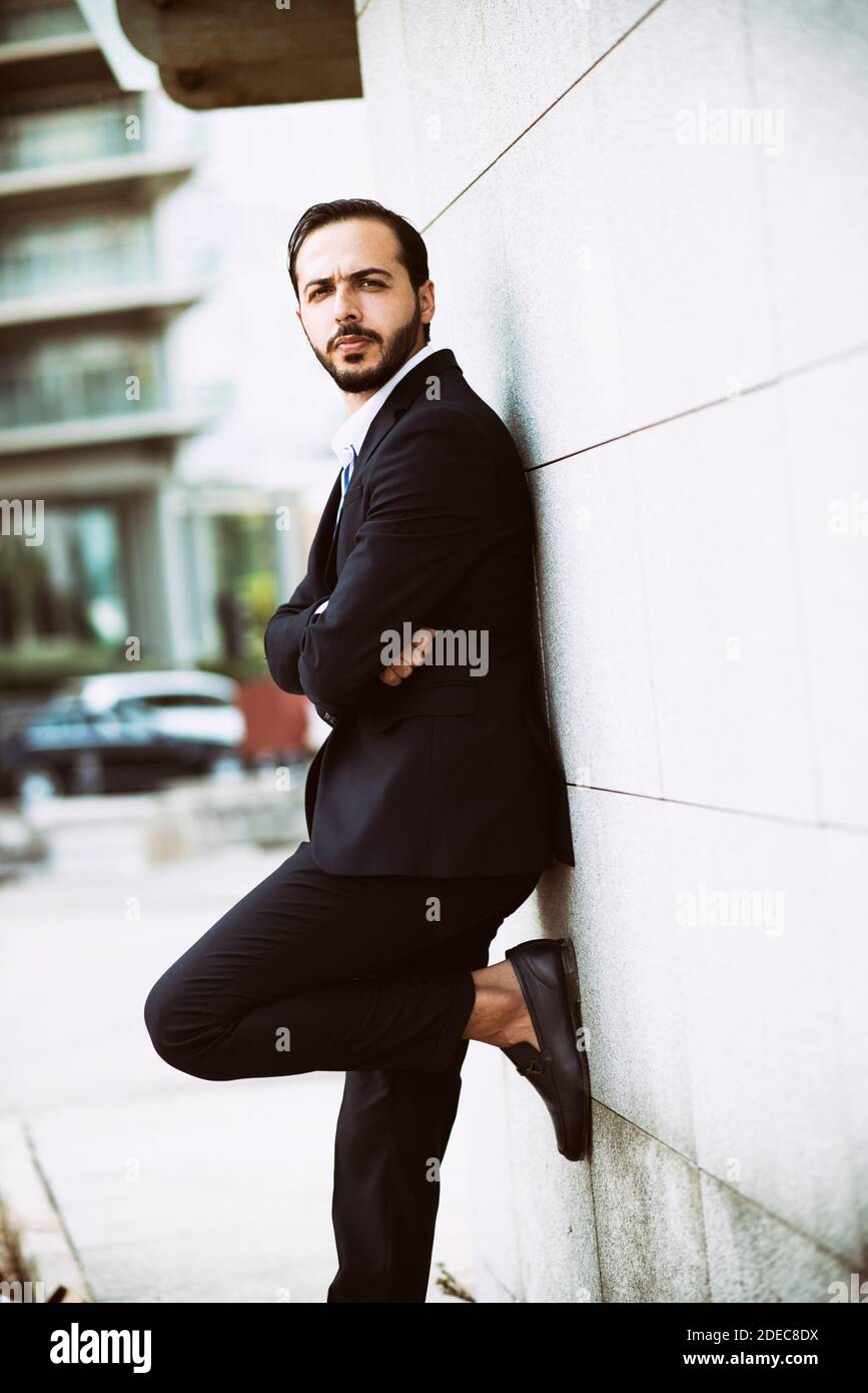 Middle eastern business man standing outdoors looking at camera Stock ...