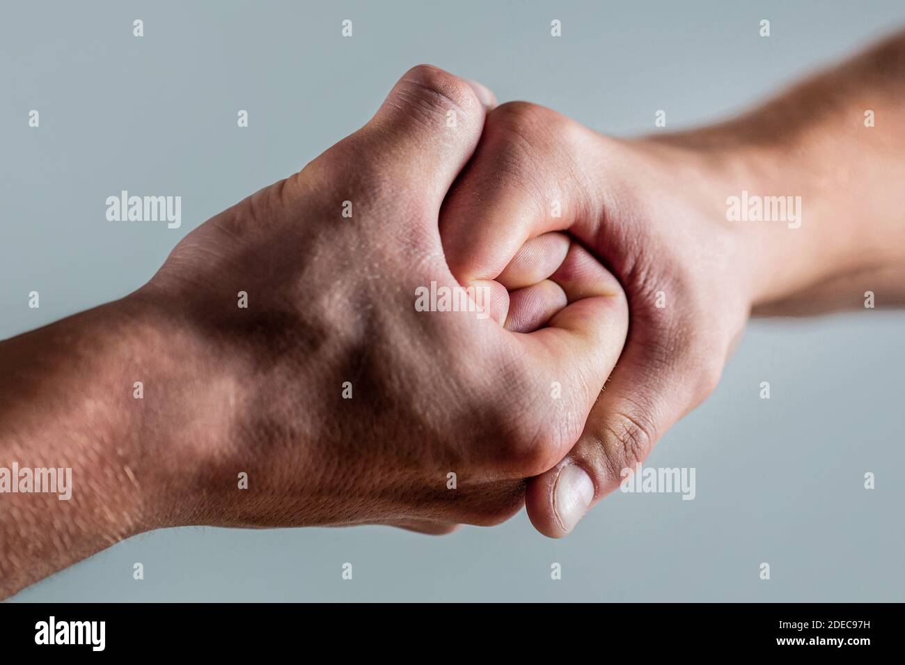 Friendly handshake, friends greeting. Rescue, helping hand. Male hand ...
