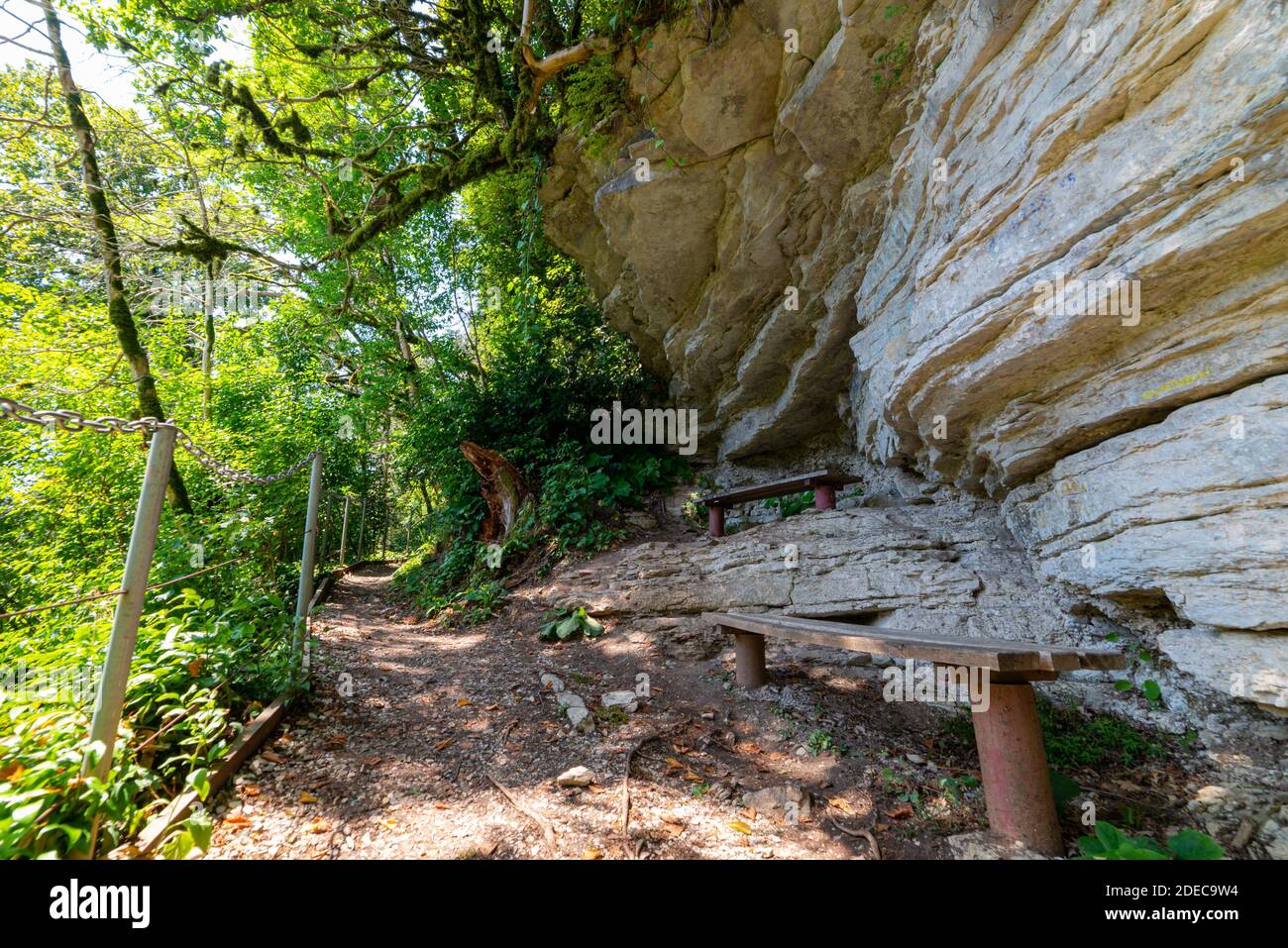 Textures of various stone layers on cliff. Benches in rest place on ...