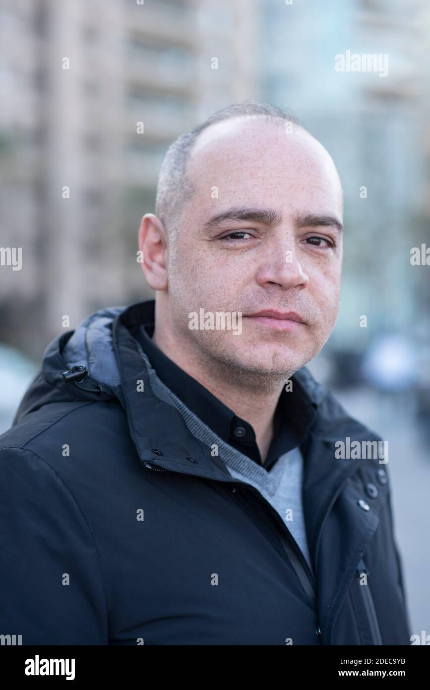 45 years old man looking at camera outdoors Stock Photo - Alamy