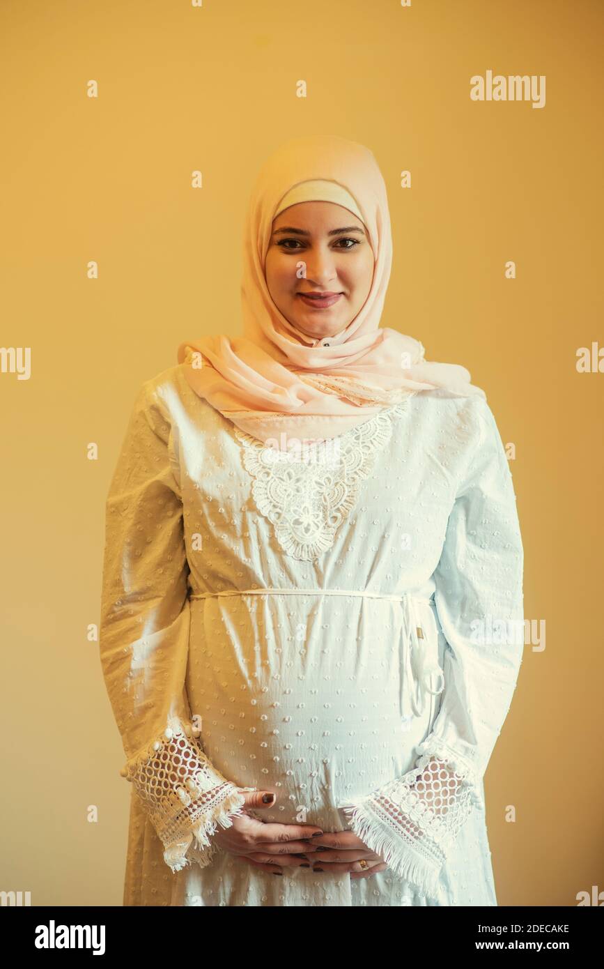 Happy Muslim pregnant woman Stock Photo - Alamy