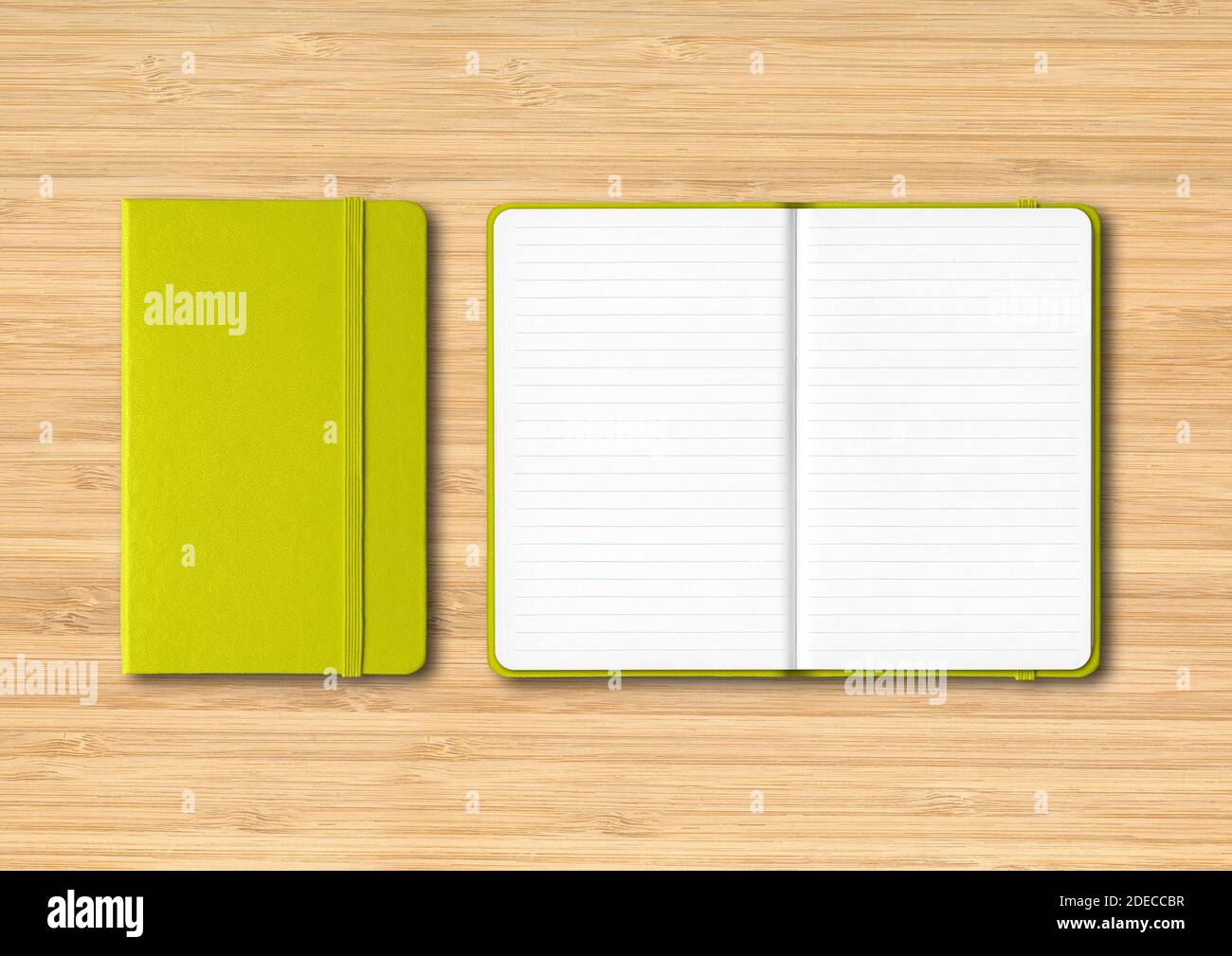 Lime green closed and open lined notebooks mockup isolated on wooden ...