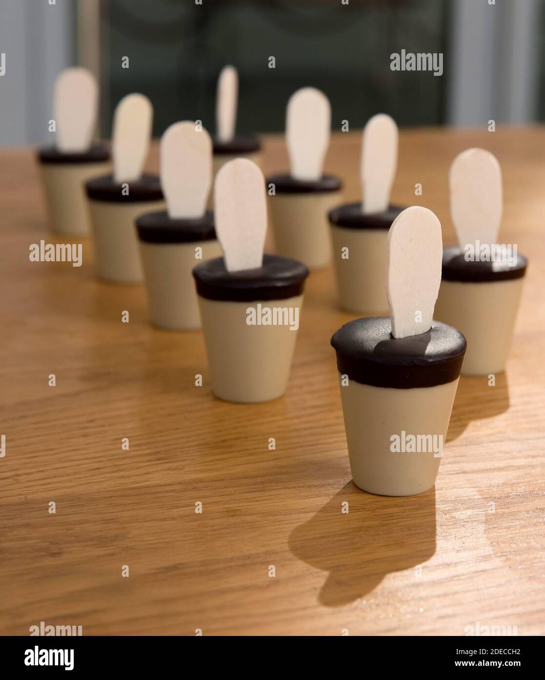 Chocolate flavoured mousse on a stick on a buffet table Stock Photo - Alamy