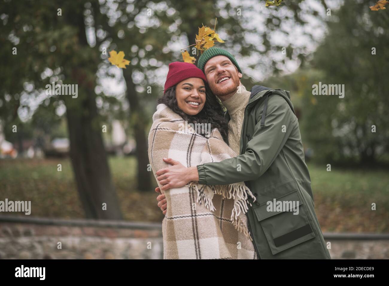 Beautiful young couple having an autumn date Stock Photo - Alamy